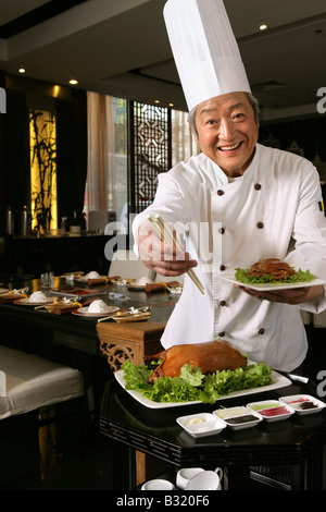 Chinese Cook Cooking Beijing Duck Stock Photo - Alamy