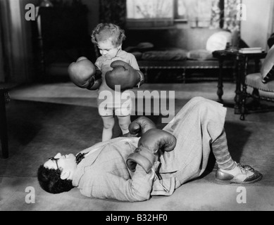 Little boy with big boxing gloves Stock Photo - Alamy
