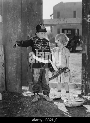 Brave little boy protecting girl from bullying in classroom Stock Photo ...