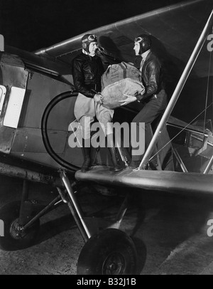 delivery man and cargo plane flying over urban skyline for delivering ...
