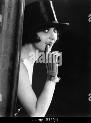 shush gesture woman top secret focused stare Stock Photo - Alamy