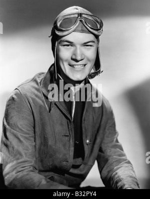 Close up of handsome pilot wearing headphones Stock Photo - Alamy