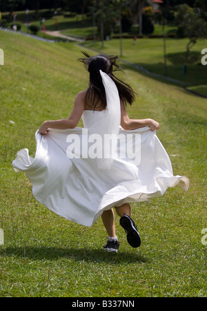 Bride runs away Stock Photo - Alamy