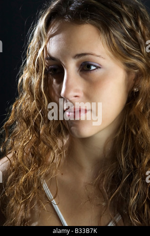 A profile shot of a demure and attractive young model Stock Photo - Alamy
