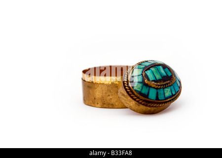 Gold and turquoise inlay pill box, white background Stock Photo - Alamy