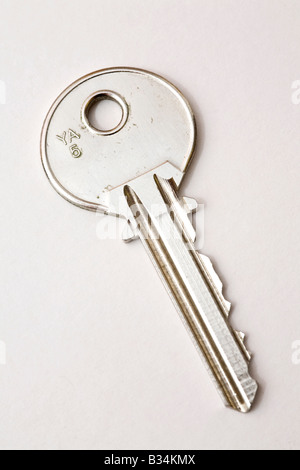 Yale key on a white background Stock Photo - Alamy