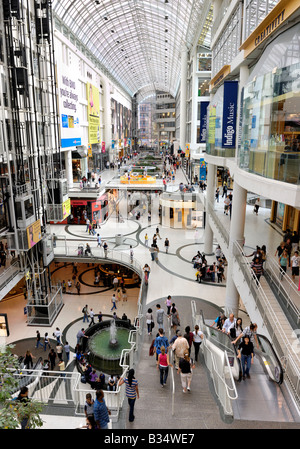 Shoppers inside the Eaton Centre shopping mall complex in Toronto ...