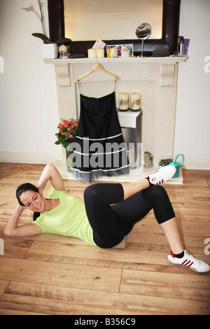 Females doing sit-ups exercises to strengthen their abdomen muscles ...