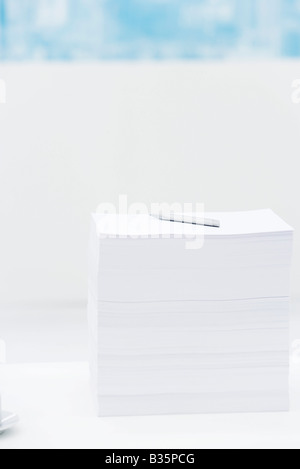 Pile of papers on white Stock Photo - Alamy
