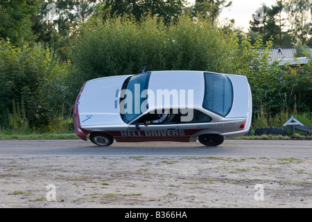 BMW car on 2 wheels stunt Stock Photo - Alamy