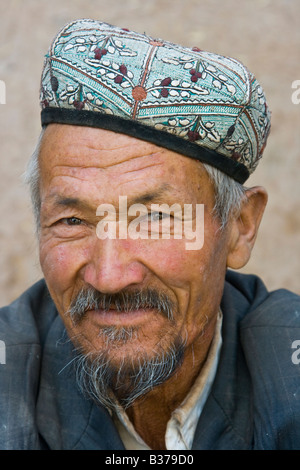 Portrait of old Uyghur man at Kashgar livestock market Xinjiang China ...
