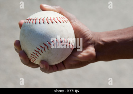 Hand holding a softball Stock Photo - Alamy