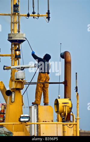 Fisherman working on trawler Stock Photo - Alamy