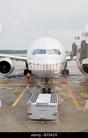 Commercial Aircraft parked at gate with jet bridge for passenger ...