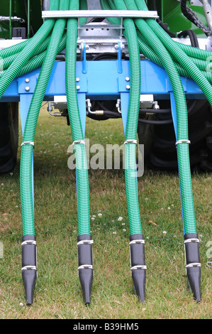 Pipes on the back of slurry spreader with injection system attached ...