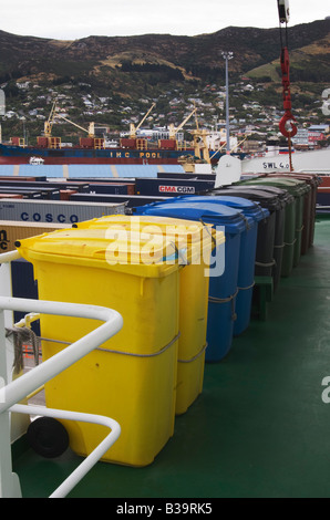 garbage bin on ship deck with blue floor and white railings Stock Photo ...