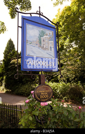 UK Cheshire Tarporley village Centre High Street visitors walking past ...