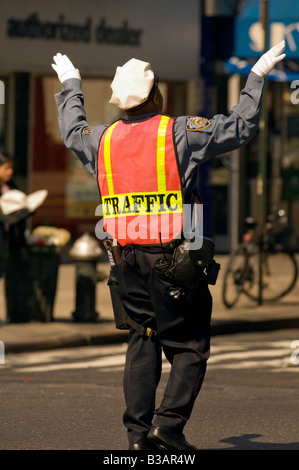 New York City cop directing traffic at busy intersection USA Stock ...