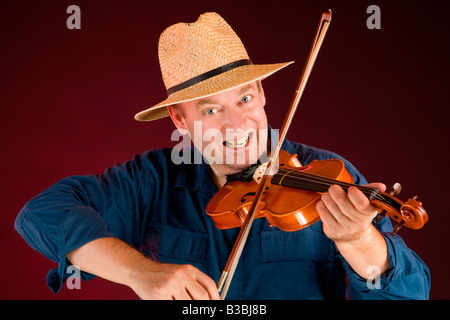 A man playing fiddle violin for Traditional welsh folk dancers ...