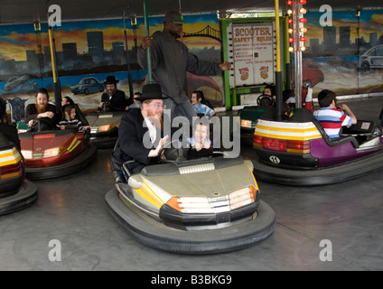 Orthodox Jewish men and boys ride the bumper cars at Coney Island ...