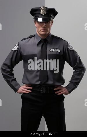 A portrait of old man security guard is standing outside of his job for ...