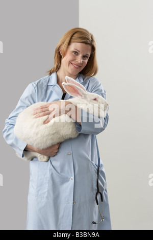 Veterinarian Holding Giant Rabbit Stock Photo - Alamy