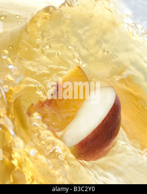 Two slice peach close up isolated on a white background Stock Photo - Alamy