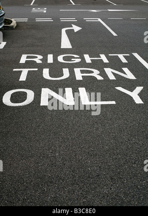 Road marking with a right turn arrow and a straight arrow Stock Photo ...