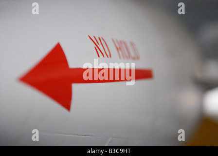 Aircraft signage with red arrow Stock Photo - Alamy