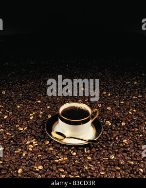 A cup of coffee on a black background. shot from the top with chalk ...