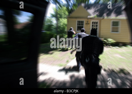 Detroit police officers raid a house in Detroit, Michigan, USA Stock ...