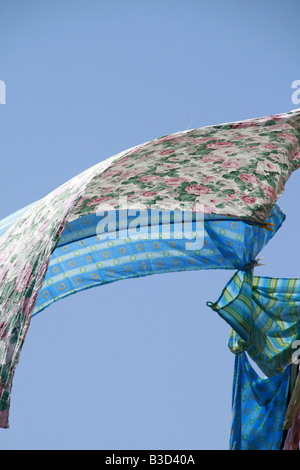 bedding flying in wind on washing line in sun Stock Photo - Alamy