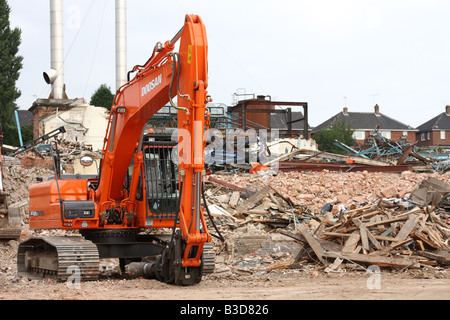 A caterpillar tracked earthmover on a demolition site Stock Photo - Alamy