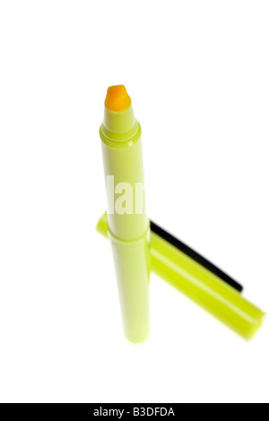 An open green highliter marker on a yellow background with copy space ...