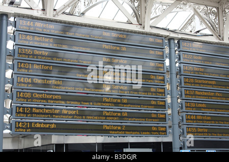 An electronic, train station information and departure board showing ...