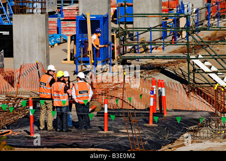 group of workmen on building construction site Stock Photo - Alamy