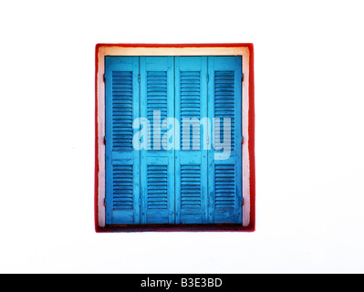 window with light blue wooden shutters and wrought iron window box at ...