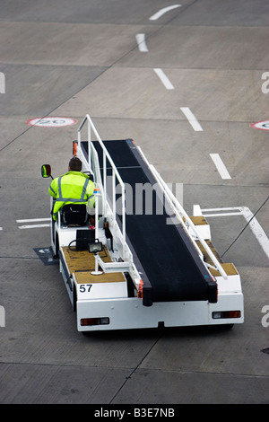 Air Side baggage handler Stock Photo - Alamy