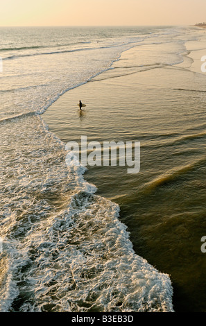 Lone surfer waiting for waves in Ngunguru Bay, near Pataua, Northland ...