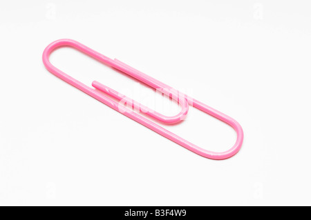 Pink paper clip on white background Stock Photo - Alamy