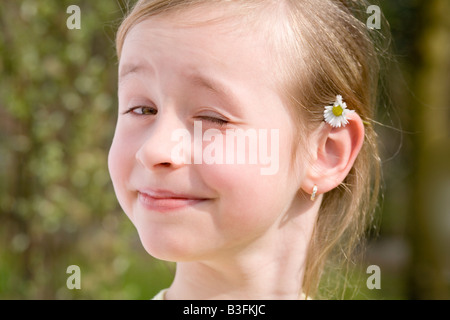 young girl smiling cheekily Stock Photo - Alamy