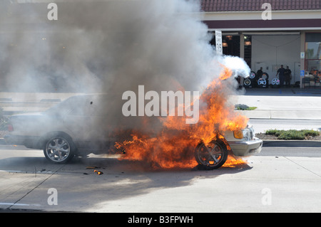 An overheating Mercedes Benz catches fire on a street in Carson on a ...
