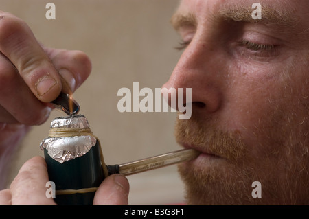 Man smoking a crack pipe Stock Photo - Alamy