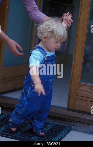 First steps with mother's help Stock Photo - Alamy