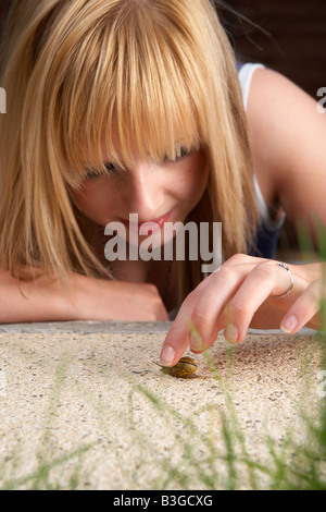 Touching a Snail Stock Photo - Alamy