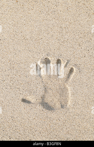 Hand-print in the sand of a beach Stock Photo - Alamy