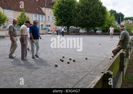 Group of men playing boules, or pétanque, a typical French ball game ...