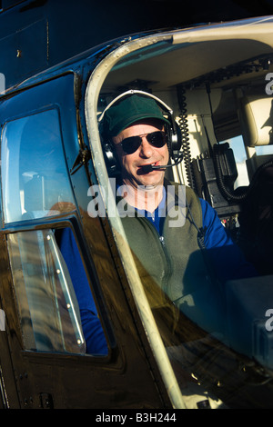 Portrait Of Male Helicopter Pilot In Cockpit Before Flight Stock Photo ...