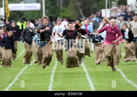 Children competing in an old fashioned traditional sack race in the ...