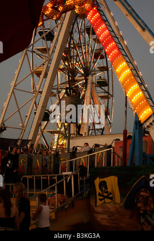People waiting in line at the amusement park to get on the rides Stock ...